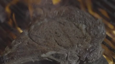 Roast beef with fire flames. Beef steak ... | Stock Video | Pond5