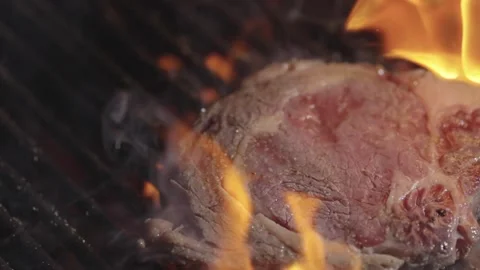 Roast beef with fire flames. Beef steak ... | Stock Video | Pond5