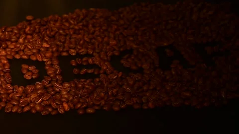 Roasted coffee beans illuminated by warm... | Stock Video | Pond5