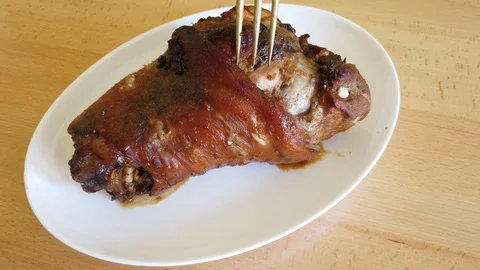 Roasted ham hock cut with knife | Stock Video | Pond5