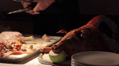 Roasted Pig with apple in mouth pan to c... | Stock Video | Pond5