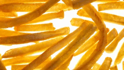 Roasted potato chips rotating on white b... | Stock Video | Pond5