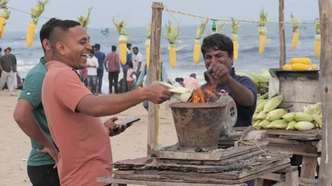 Roasting corn on Marina beach,Chennai,Ta... | Stock Video | Pond5