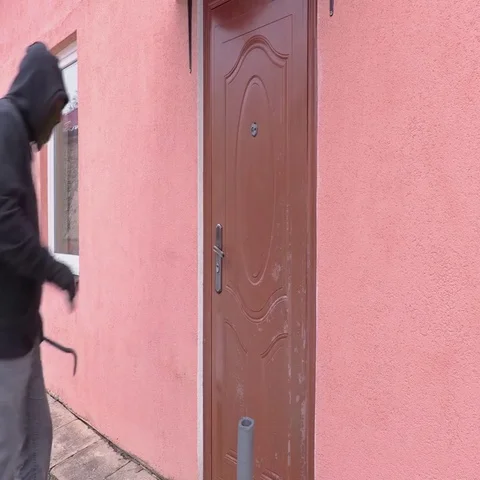 Robber with crowbar open door and get in... | Stock Video | Pond5