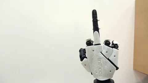 The robot arm with the middle finger up. | Stock Video | Pond5