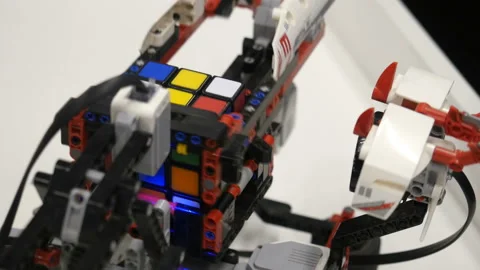 Robot assembles rubik's cube. Robot reso... | Stock Video | Pond5