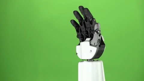 Robot hand close up waving hi . Green sc... | Stock Video | Pond5