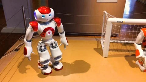 Robot moving like a human sits down on t... | Stock Video | Pond5