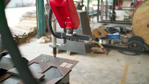 Robotic arm cutting steel plate | Stock Video | Pond5