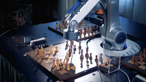 A robotic arm is moving chess pieces and... | Stock Video | Pond5