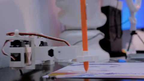 Robotic arm with orange pen drawing port... | Stock Video | Pond5