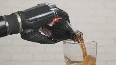 Robotic arm takes bottle of Coca-Cola an... | Stock Video | Pond5