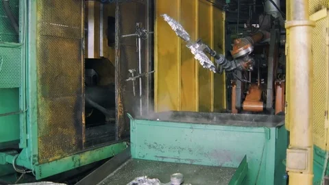 robotic arm is throwing cooled metallic ... | Stock Video | Pond5