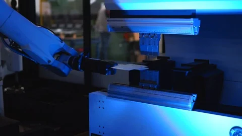 Robotic cnc arm moving a sheet of metal ... | Stock Video | Pond5