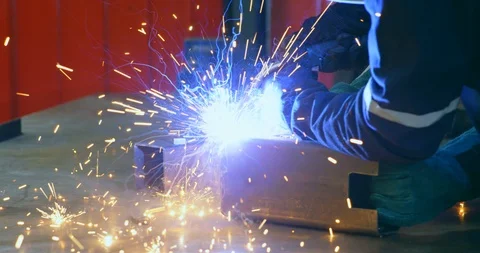 Robotic engineer welding metal in roboti... | Stock Video | Pond5