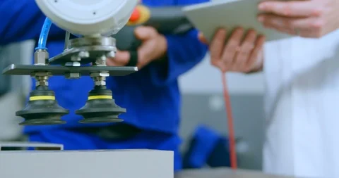 Robotic engineers testing robotic machin... | Stock Video | Pond5