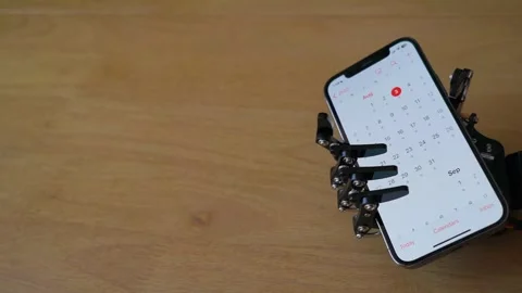 Robotic Hand Holding Phone With Calendar... | Stock Video | Pond5