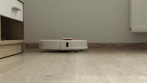 Robotic vacuum cleaner moving cleaning i... | Stock Video | Pond5