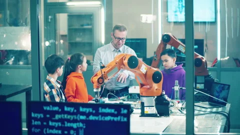 Robotics lab with kids and a male tutor.... | Stock Video | Pond5