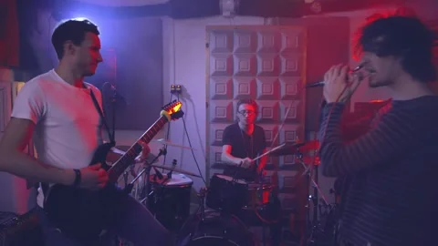 Rock band is rocking the stage in a haze... | Stock Video | Pond5