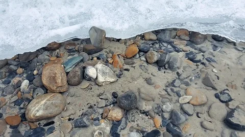 Rock being dropping into slow moving wat... | Stock Video | Pond5
