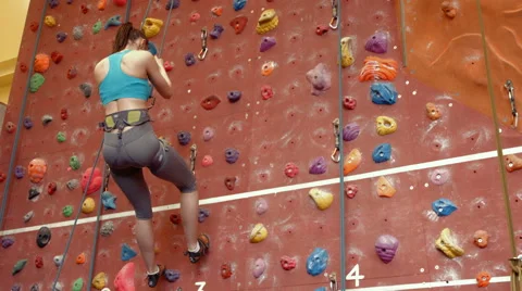 Rock climber descending the wall | Stock Video | Pond5