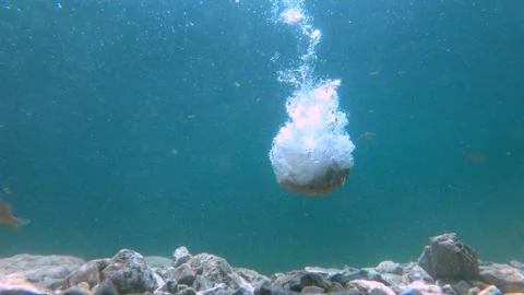 Rock falling in water. Underwater view o... | Stock Video | Pond5