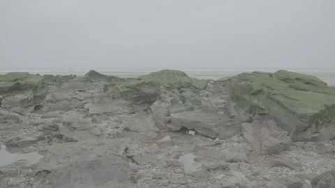 Rock formation at Omaha beach, north sea | Stock Video | Pond5