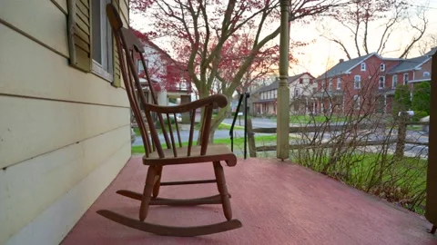 Rocking chair blowing in wind on front p... | Stock Video | Pond5