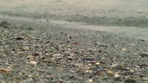 Rocky river bank with small rocks on san... | Stock Video | Pond5