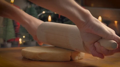 Roll out the cookies dough with a rollin... | Stock Video | Pond5