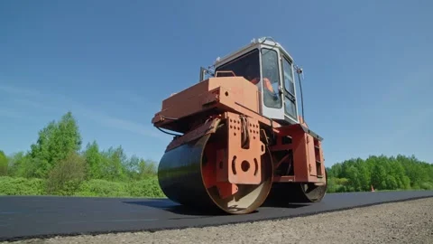 Rollers level and compact asphalt. Makin... | Stock Video | Pond5