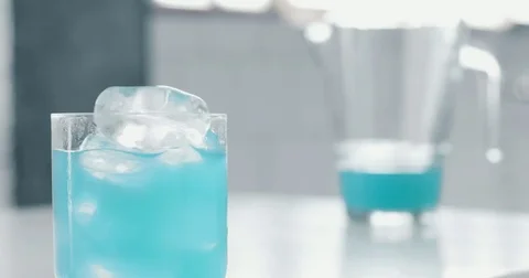 rolling on cubes of ice in glass and the... | Stock Video | Pond5