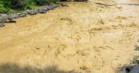 Rolling rivers carrying mud and sand. Ye... | Stock Video | Pond5