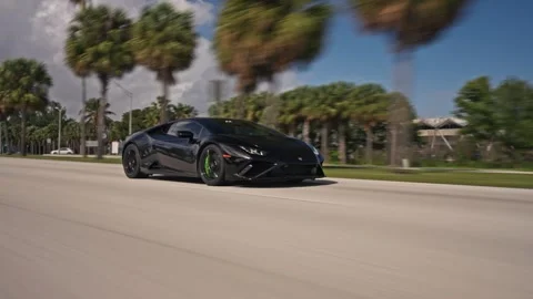 Rolling shot of black Lamborghini Huraca... | Stock Video | Pond5