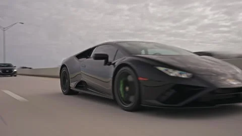 Rolling shot of black Lamborghini Huraca... | Stock Video | Pond5