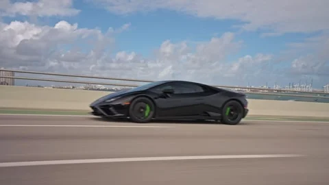 Rolling shot of black Lamborghini Huraca... | Stock Video | Pond5
