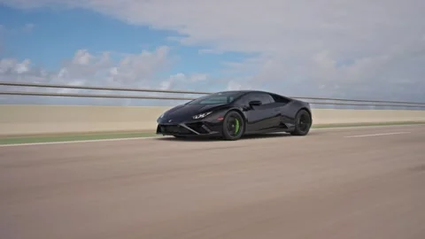 Rolling shot of black Lamborghini Huraca... | Stock Video | Pond5