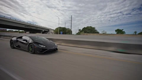 Rolling shot of black Lamborghini Huraca... | Stock Video | Pond5