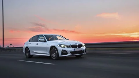 Rolling shot of a BMW 3 series sport sed... | Stock Video | Pond5