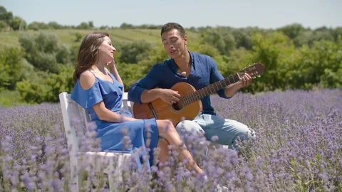 Man Serenading Woman Stock Footage ~ Royalty Free Stock Videos | Pond5