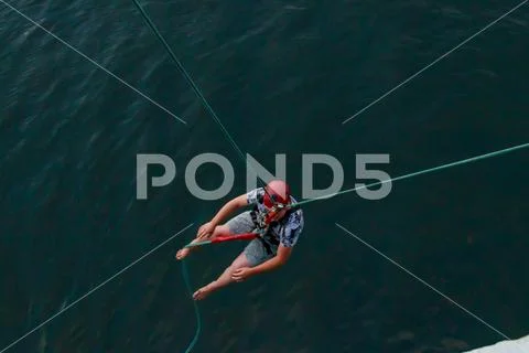 Photograph: Rope jumping from high altitude of bridge. Bungee jumping ...