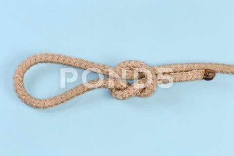 Rope Noose knot on a blue background Stock Photo #231979750