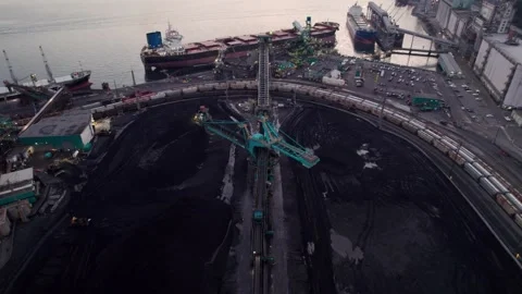 Rotary shovel at coal pile loading freig... | Stock Video | Pond5