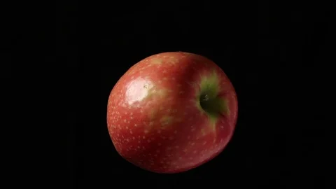 rotating apple on a black background | Stock Video | Pond5