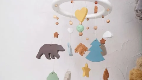 rotating baby mobile above the bed | Stock Video | Pond5