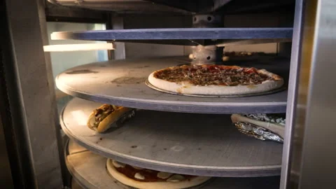Rotating baking oven filled with various... | Stock Video | Pond5