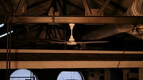 Rotating ceiling fan inside a building | Stock Video | Pond5