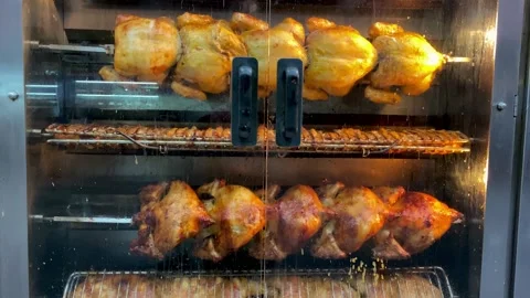 Rotating delicious grilled whole chicken... | Stock Video | Pond5