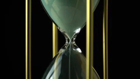Rotating hourglass clock time concept. O... | Stock Video | Pond5